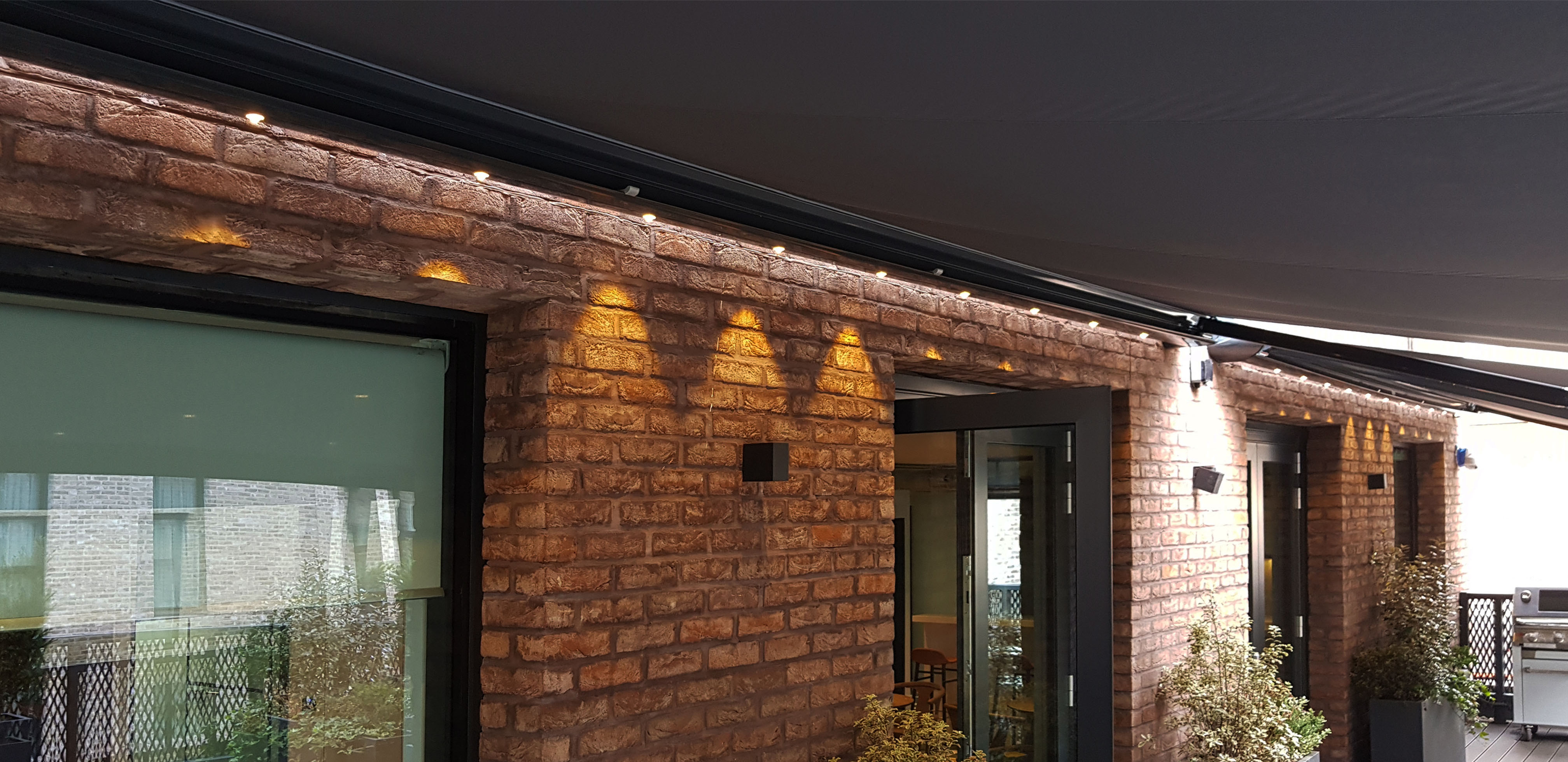 Zenara awnings installed at Spring Mews with LED Lights | Morco Blinds